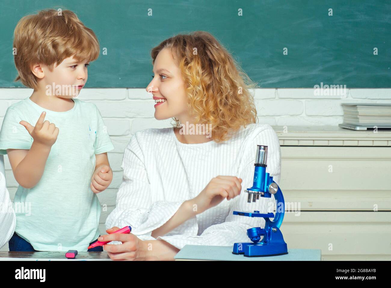 Mother father and son together schooling. Boy from elementary school ...