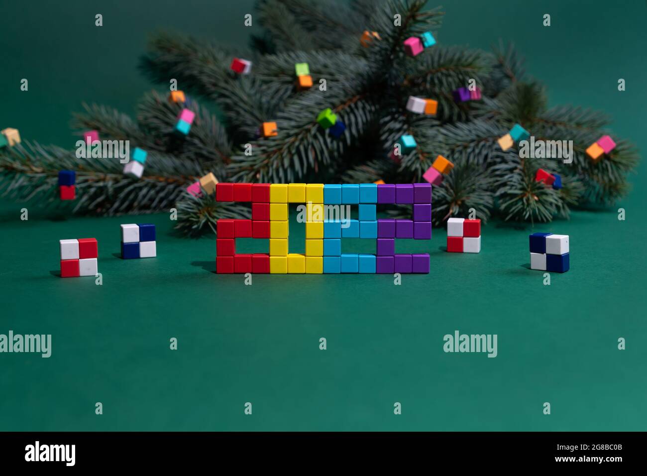 Christmas composition with a fir tree branch and colorful cubes from a ...