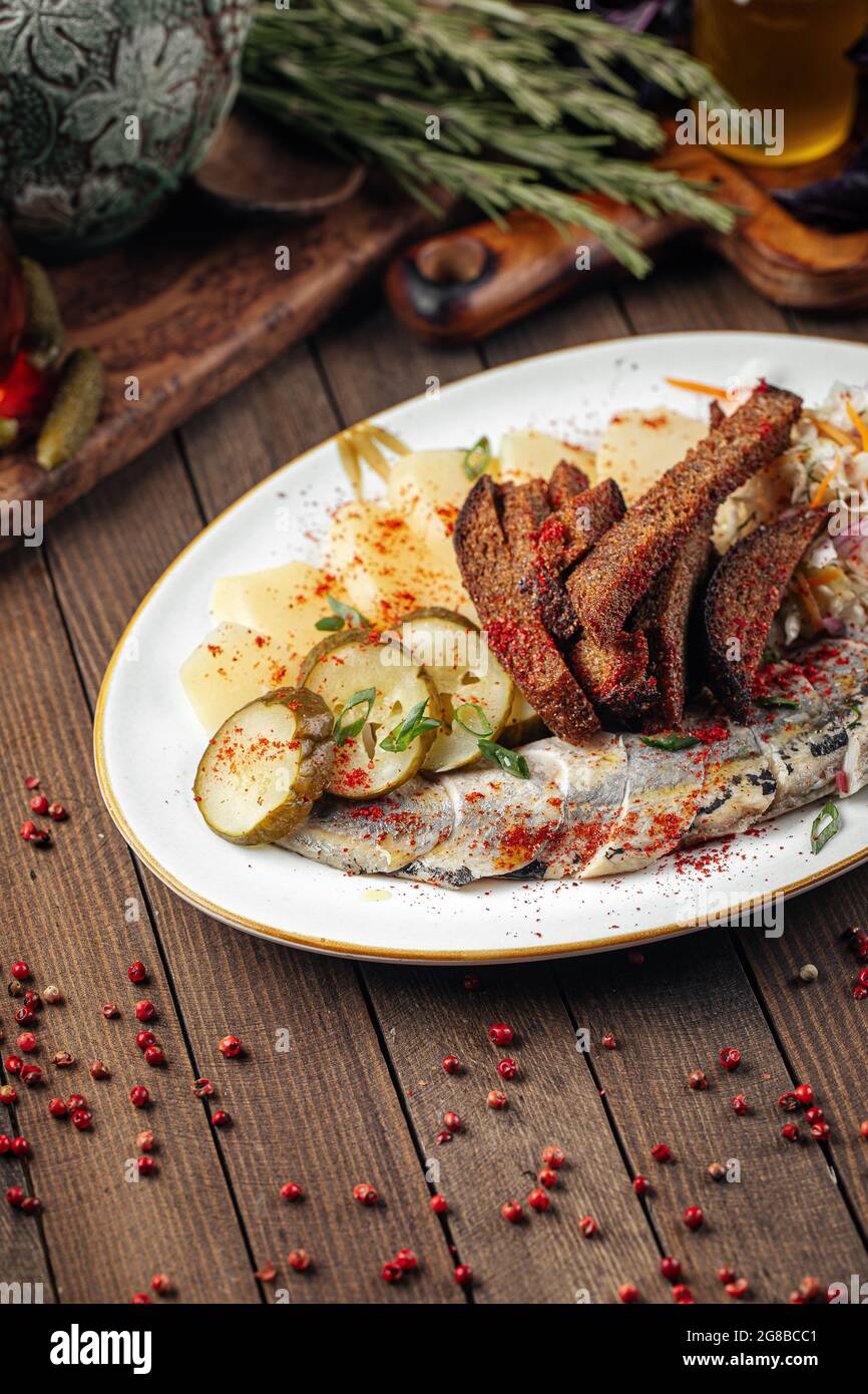 Traditional russian snacks with herring and pickle Stock Photo - Alamy