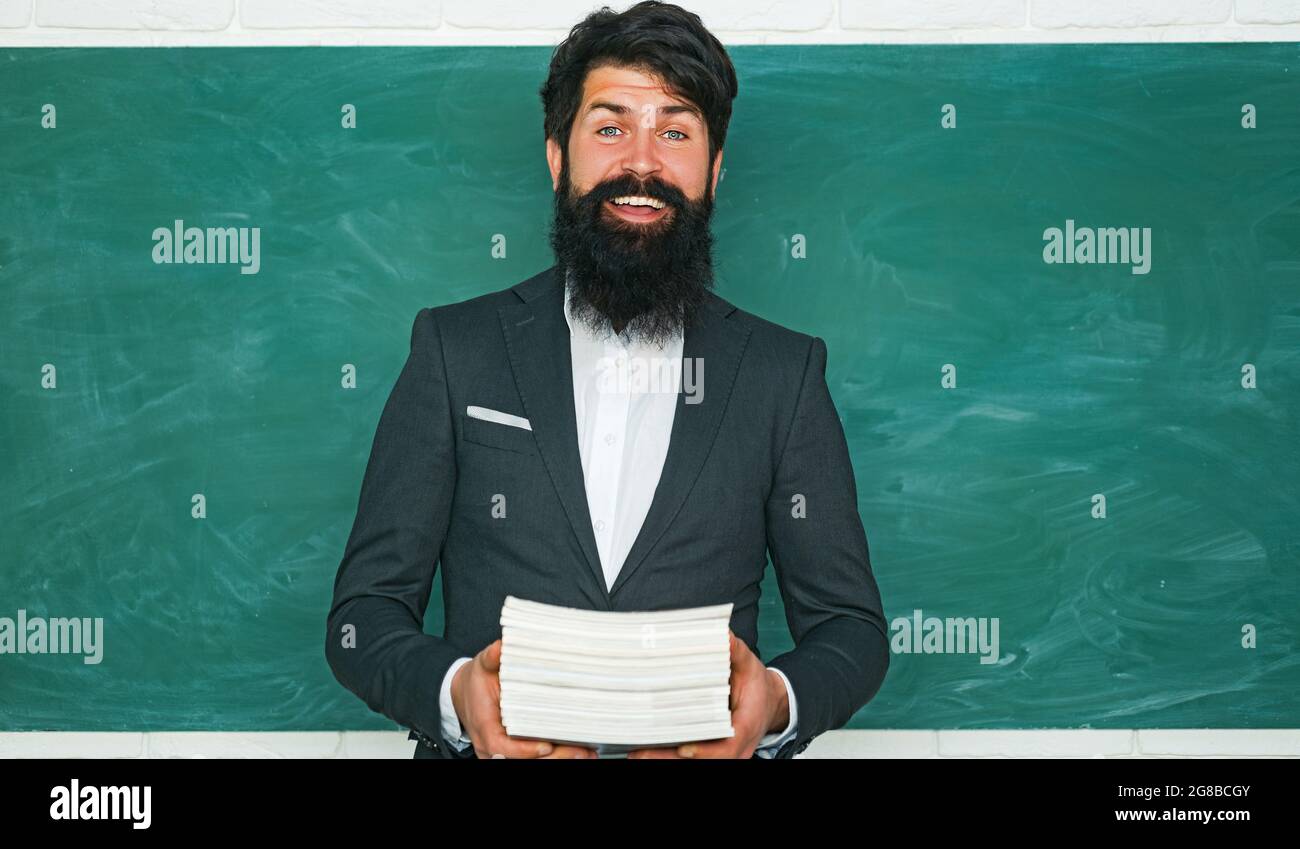 Teachers day - knowledge and educational school concept. Teacher is ...