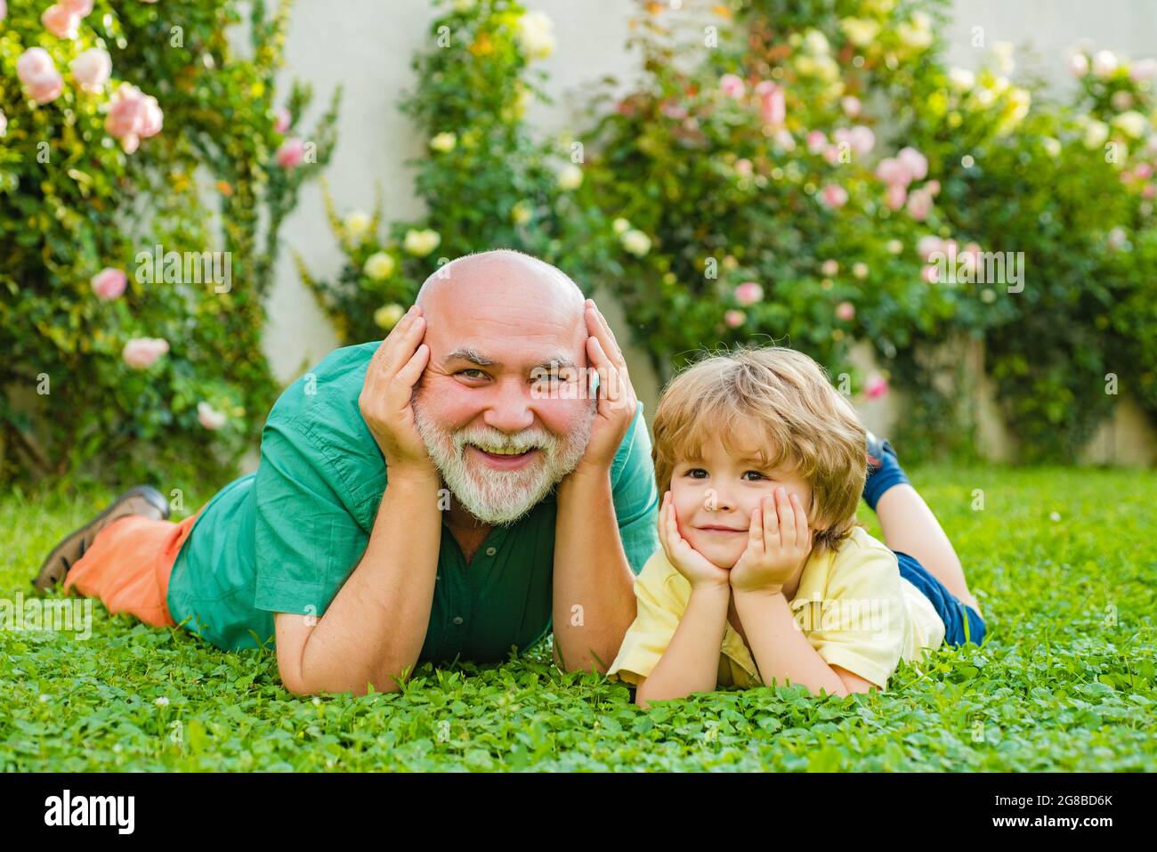 Happy family Grandson hugs his grandpa on holiday. Grandfather and ...