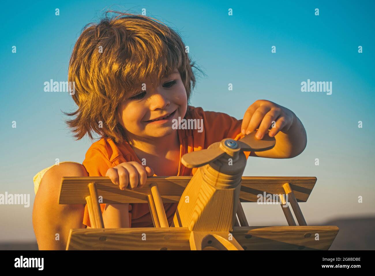 Child dreams of traveling and playing with an airplane pilot aviator ...