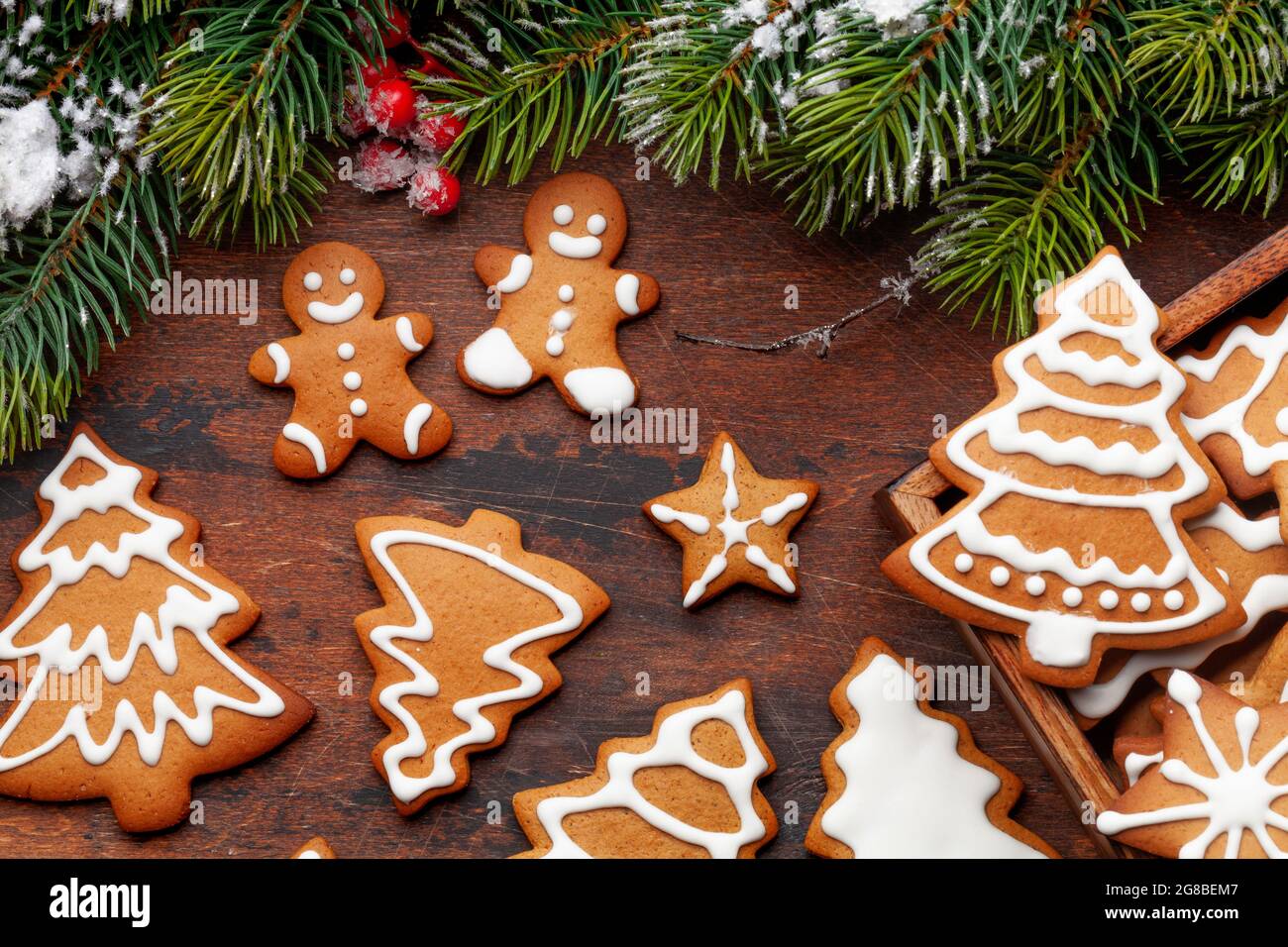 Christmas card with gingerbread cookies and fir tree. Top view flat lay ...