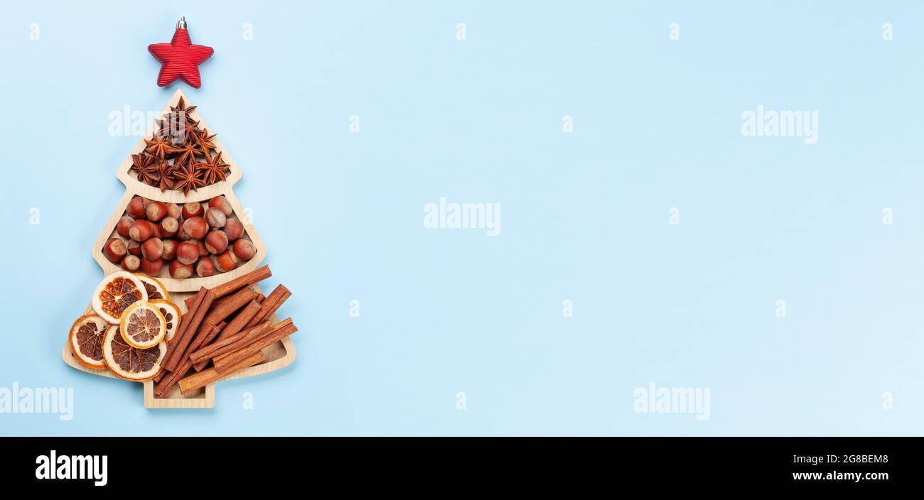 Various spices and ingredients for Christmas drinks in fir tree shaped ...