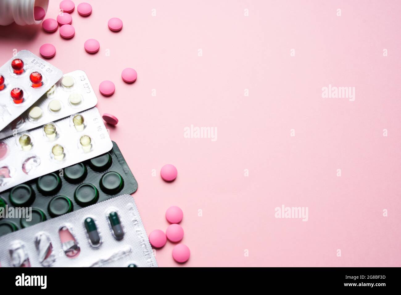 pills in packages pharmaceuticals top view pink background medicine ...