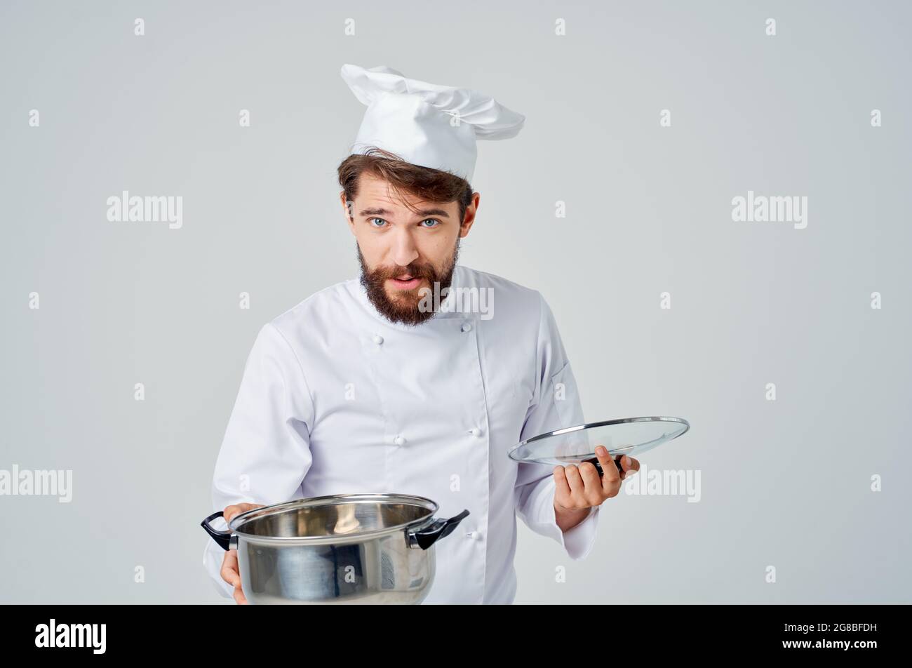 emotional chef with a saucepan in his hands dissatisfaction kitchen ...