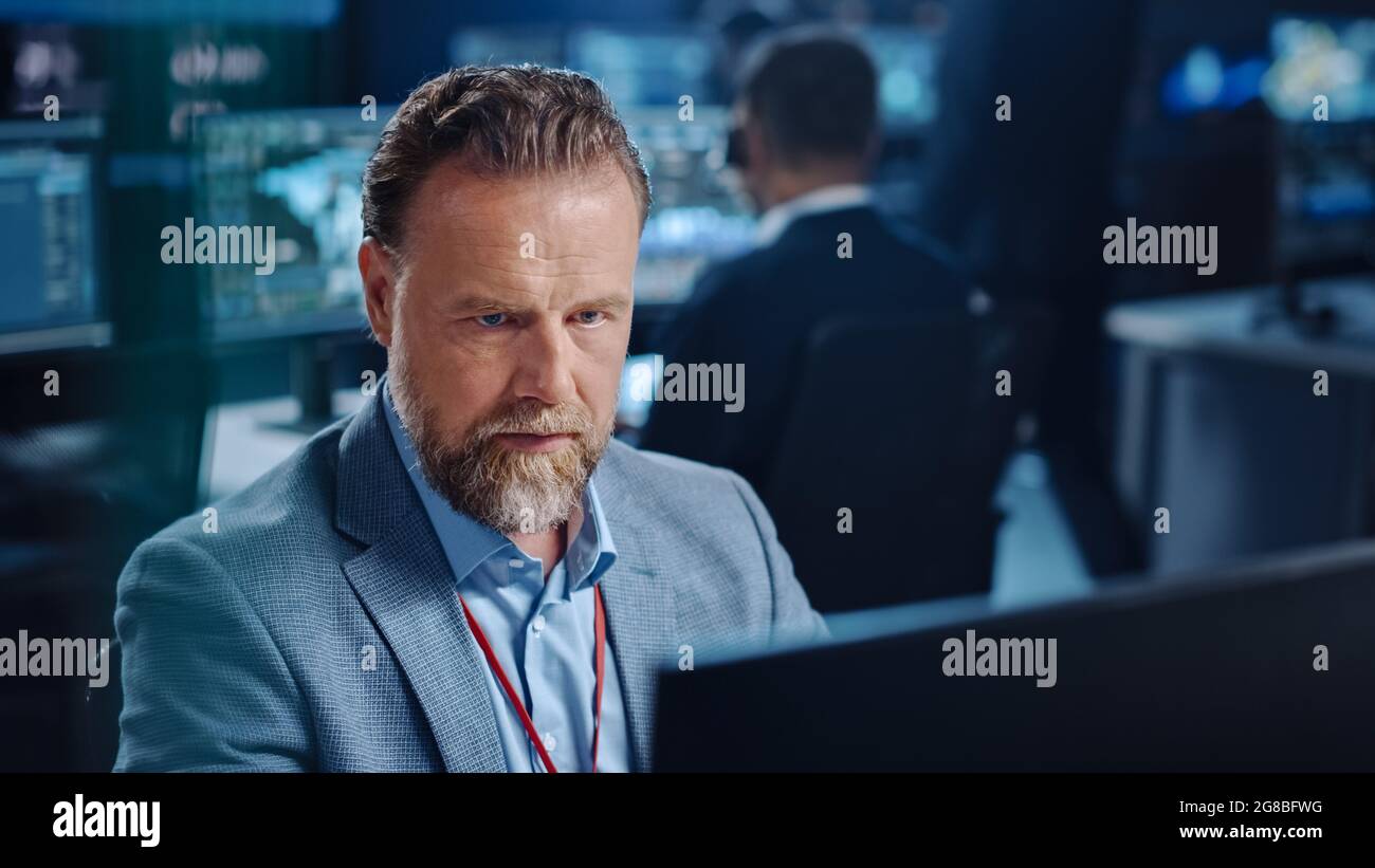 Portrait of Serious Professional Technical Controller Sitting at His ...