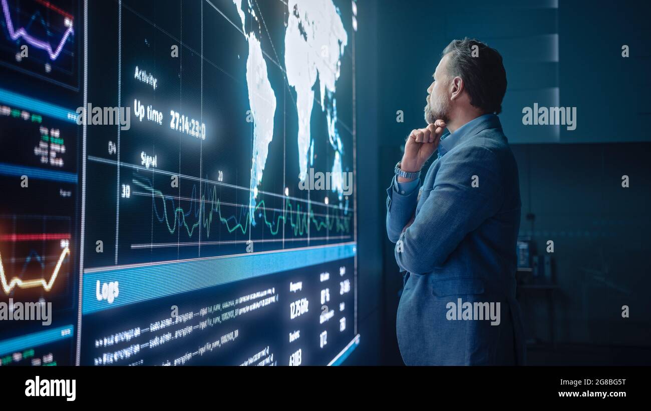 Senior Computer Science Engineer Looking at Big Screen Display Showing ...