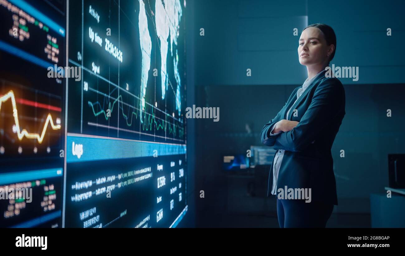 Young Female Computer Science Engineer Looking at Big Screen Display ...