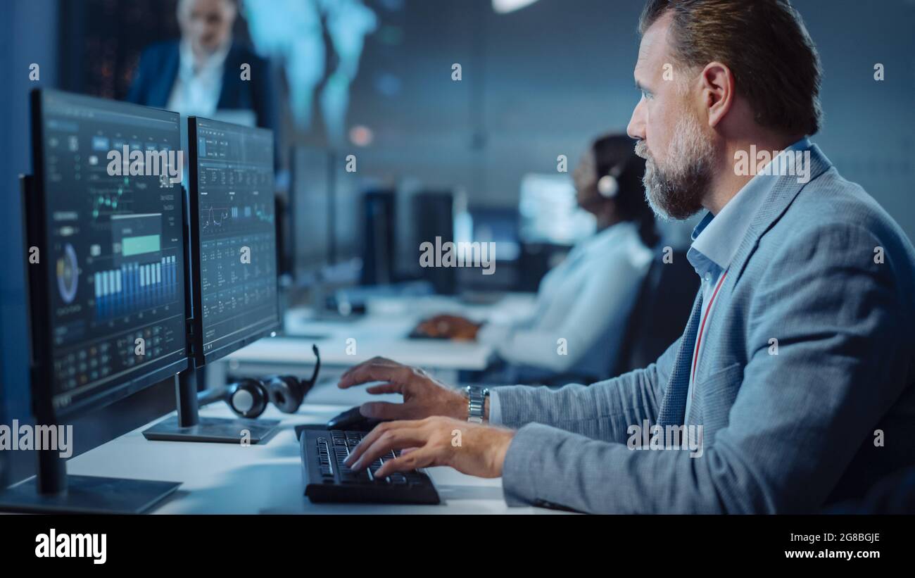 Portrait of Serious Professional Technical Controller Sitting at His ...