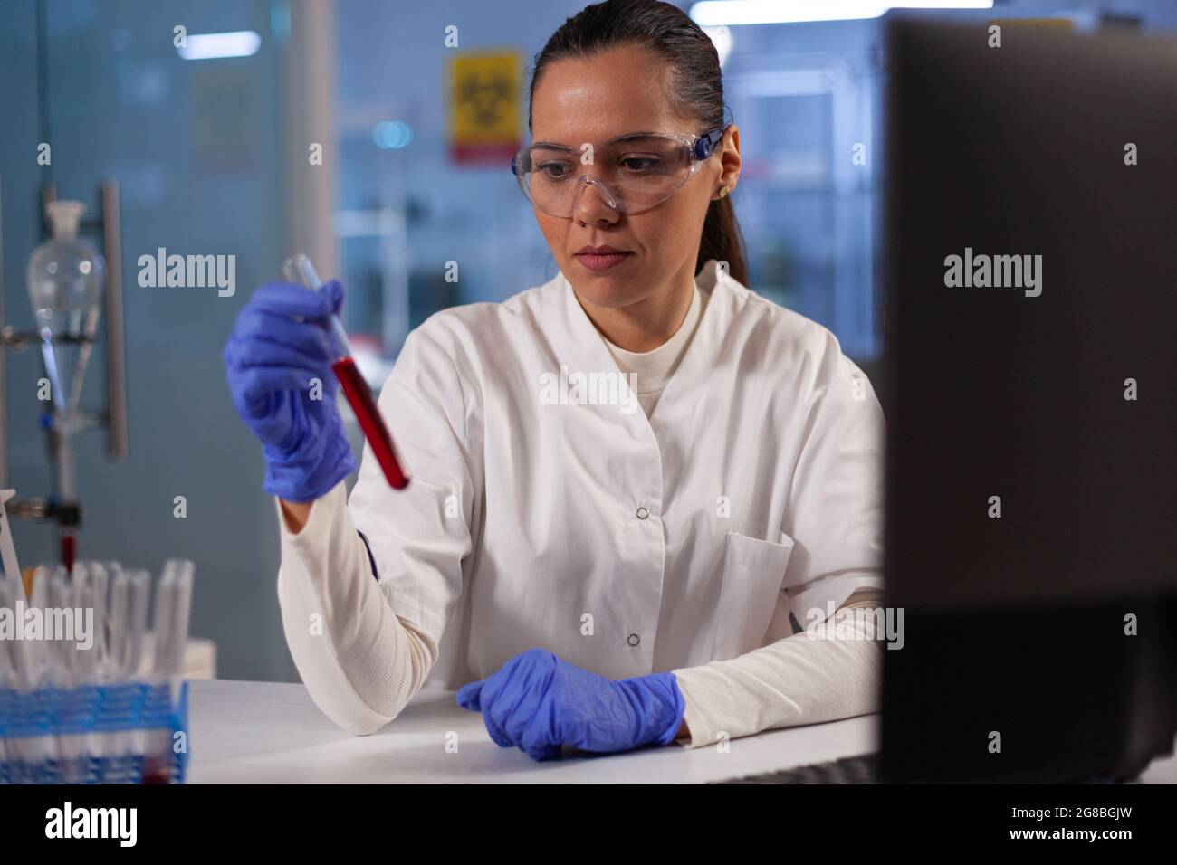 Doctor doing blood test microscope hi-res stock photography and images ...