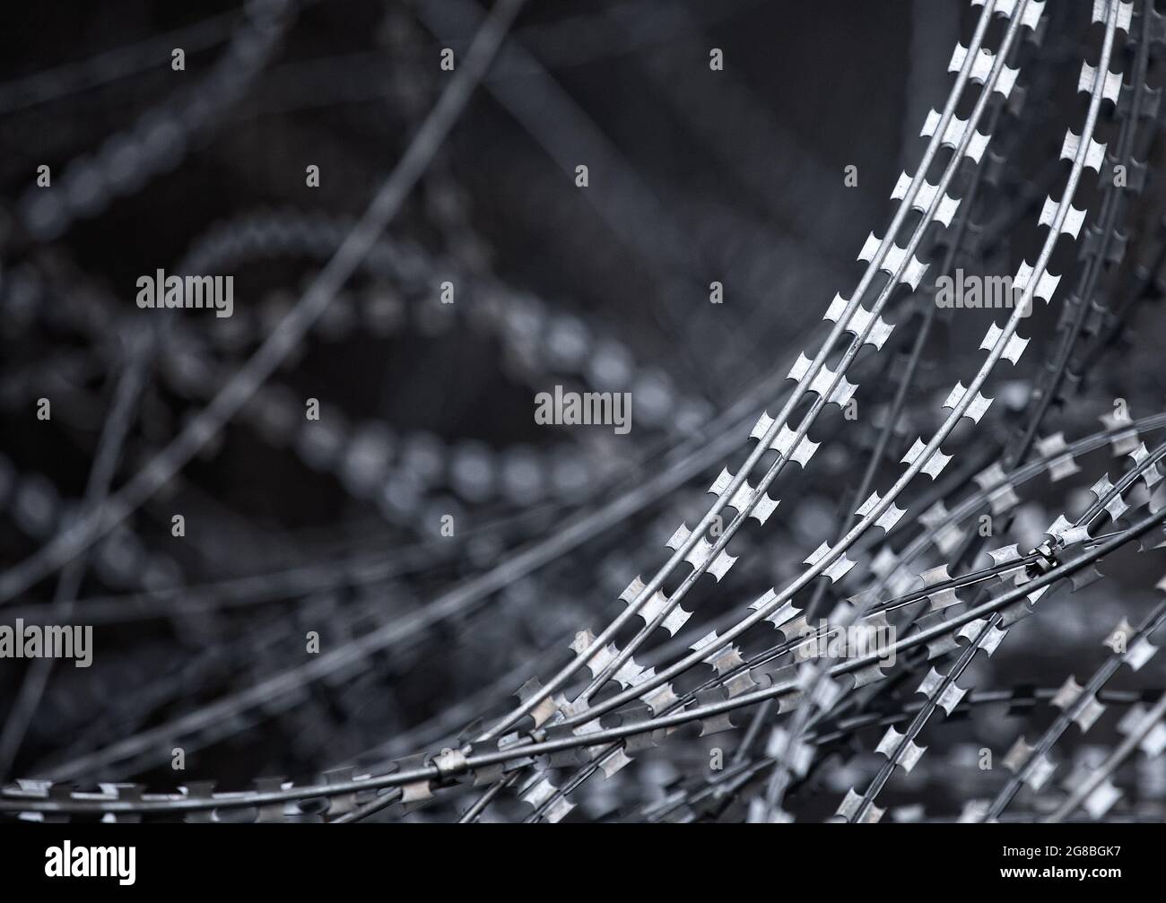 Sharp metal barbed wire processed in grunge style Stock Photo - Alamy