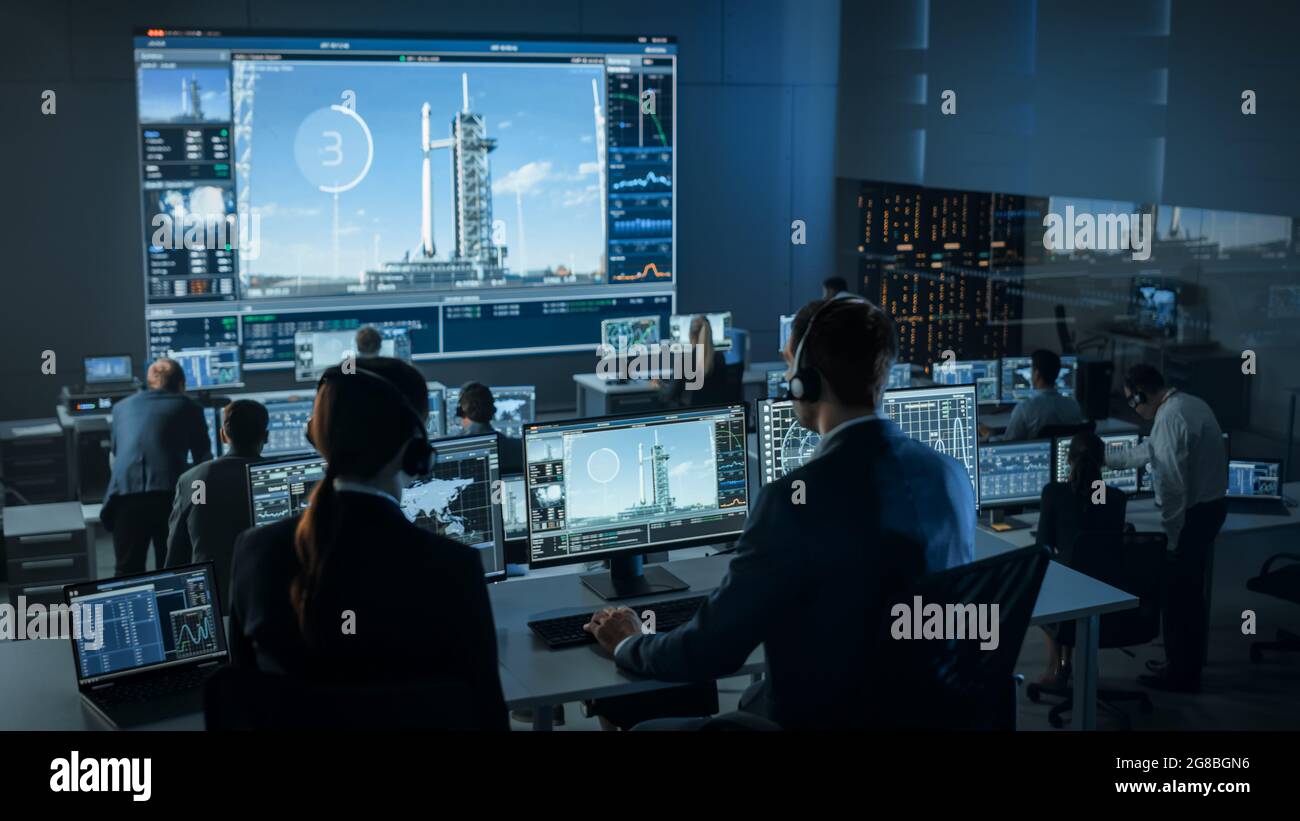 Group of People in Mission Control Center Witness Successful Space ...