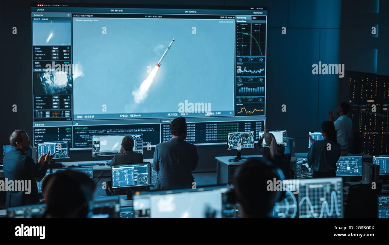 Group of People in Mission Control Center Witness Successful Space ...