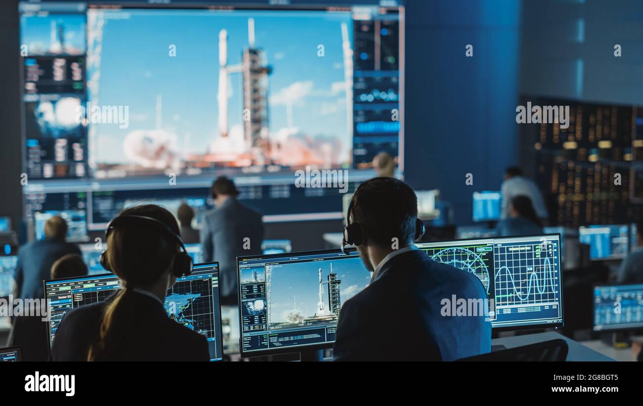 Group of People in Mission Control Center Witness Successful Space ...