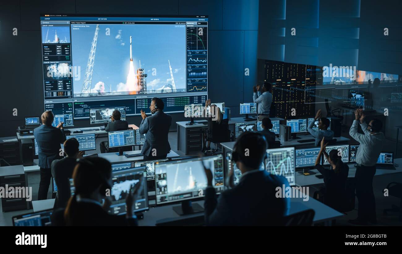 Group of People in Mission Control Center Witness Successful Space ...