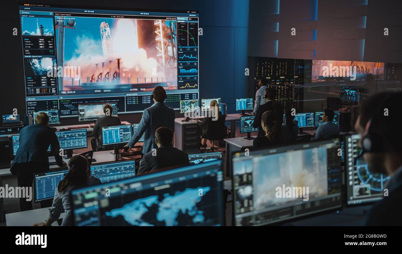 Group of People in Mission Control Center Witness Successful Space ...