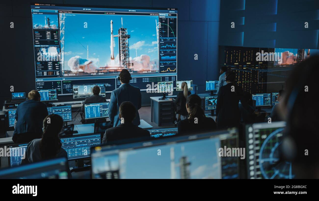Group of People in Mission Control Center Witness Successful Space ...