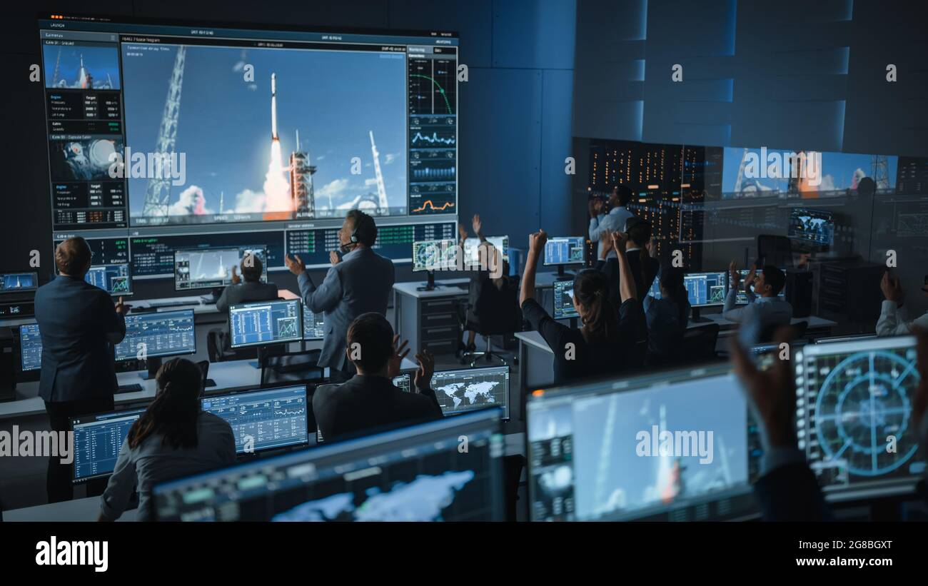 Group of People in Mission Control Center Witness Successful Space ...