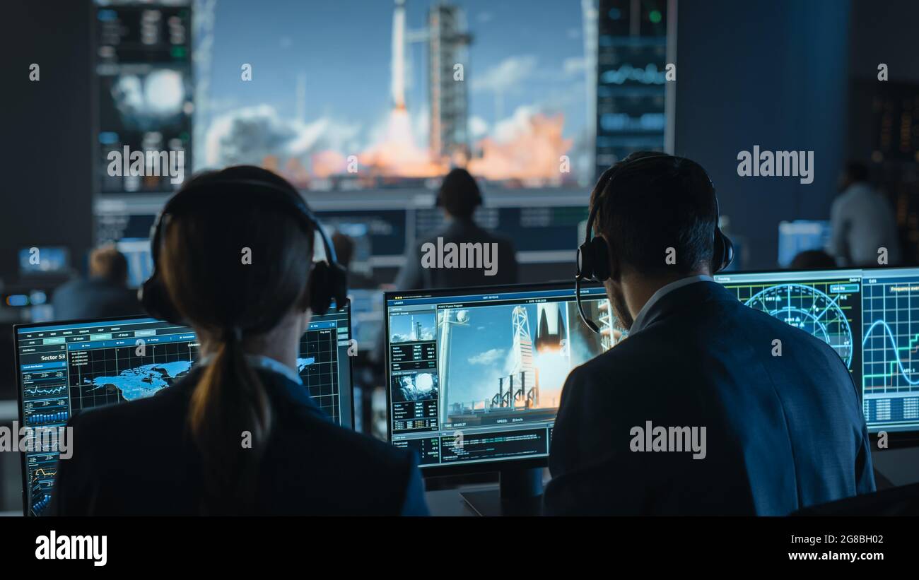 Group of People in Mission Control Center Witness Successful Space ...