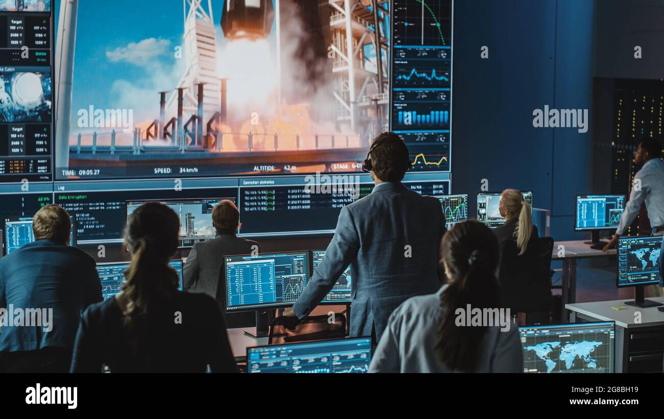 Group of People in Mission Control Center Witness Successful Space ...