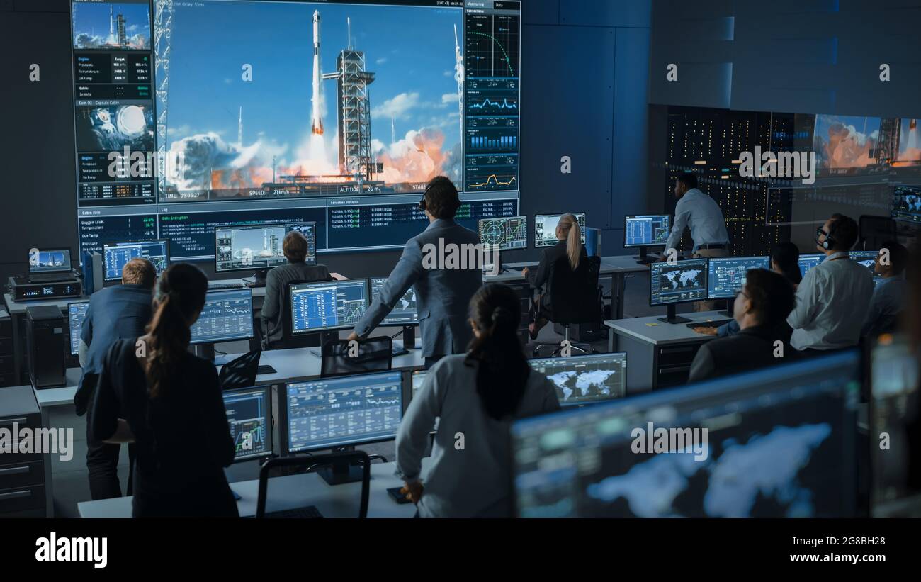 Group of People in Mission Control Center Witness Successful Space ...