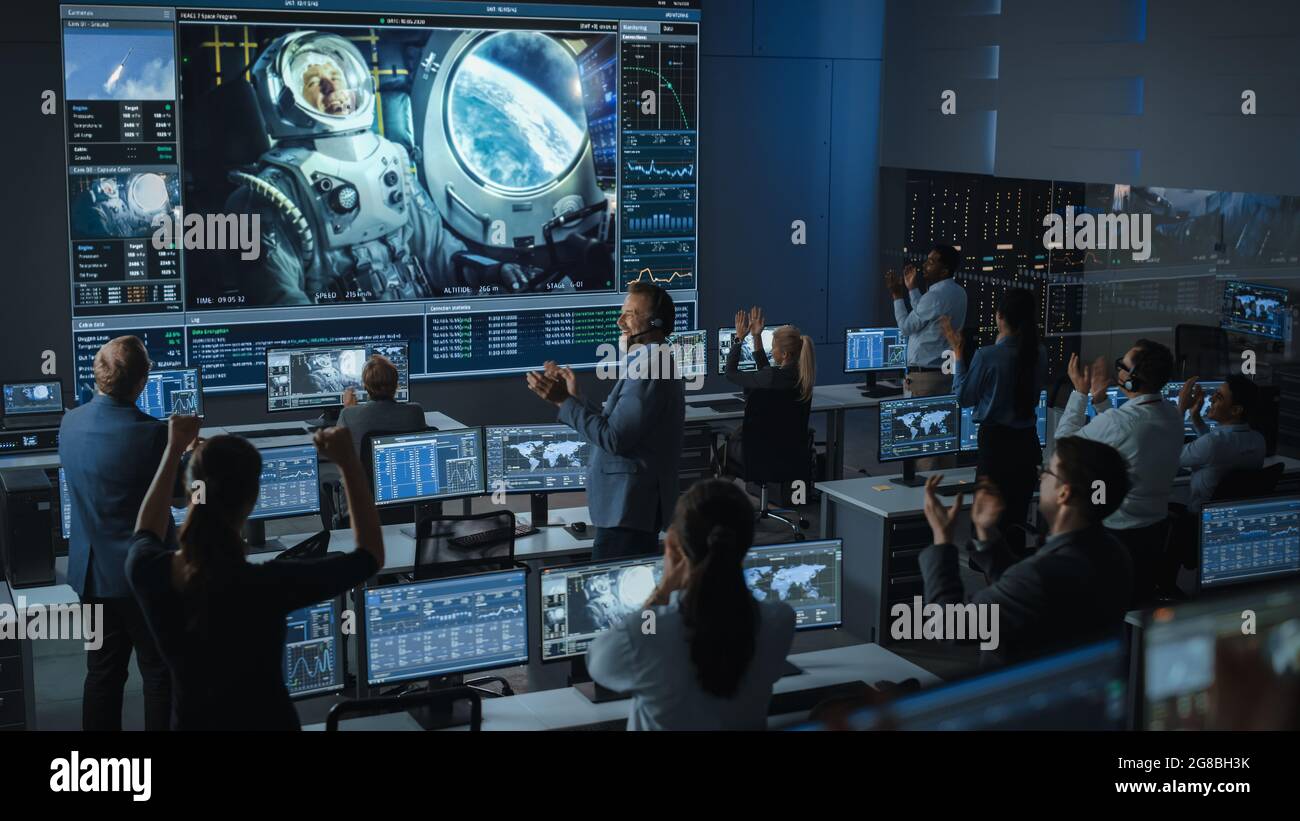 Group of People in Mission Control Center Establish Successful Video ...