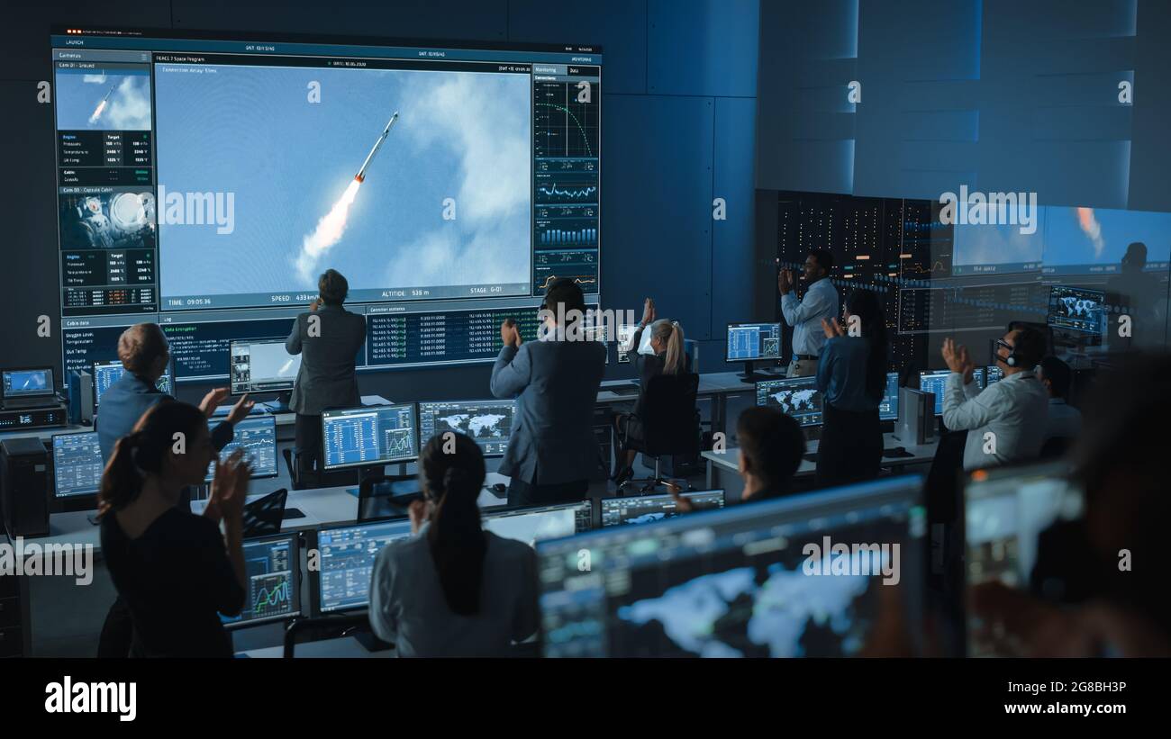 Group of People in Mission Control Center Witness Successful Space ...