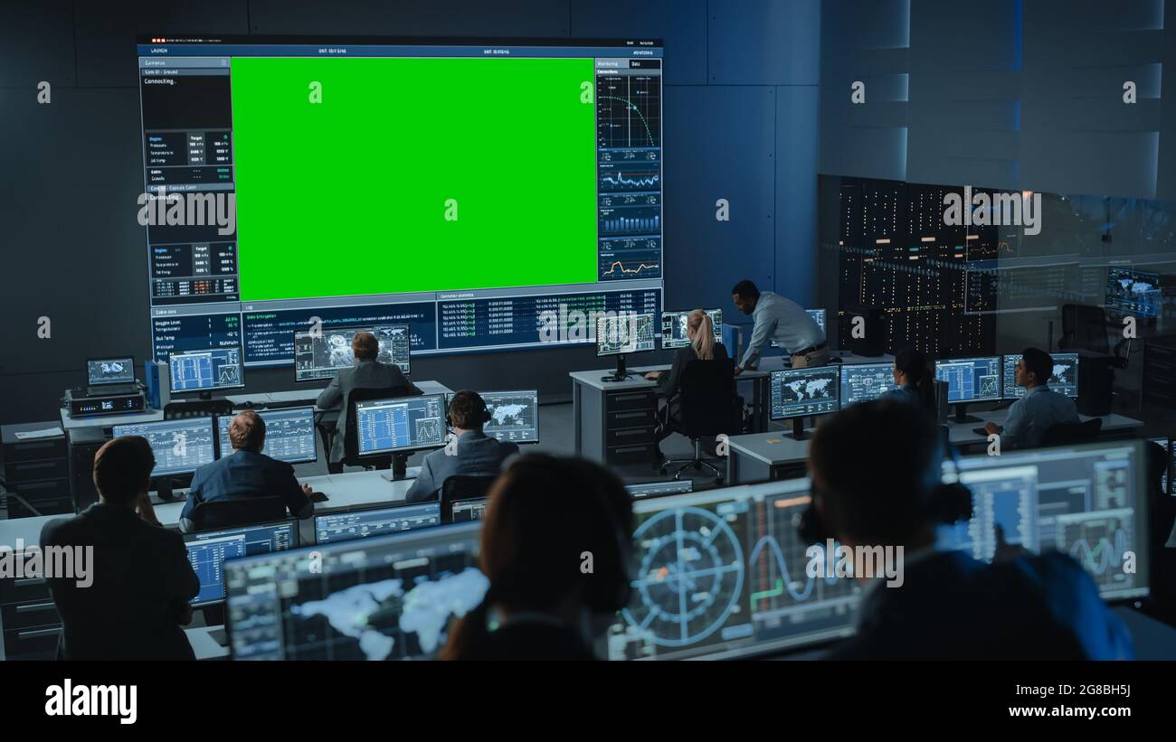 Big Green Screen Horizontal Mock Up in a Mission Control Center Room ...