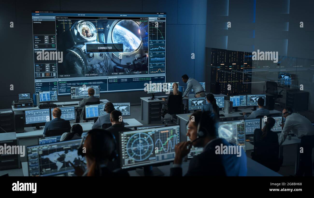 Group of People in Mission Control Center Establish Successful Video ...