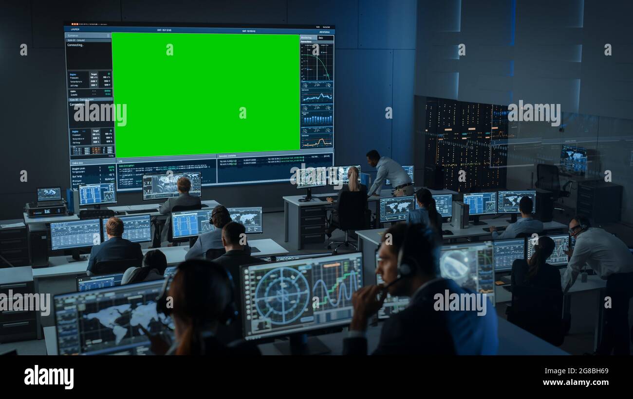 Big Green Screen Horizontal Mock Up in a Mission Control Center Room ...