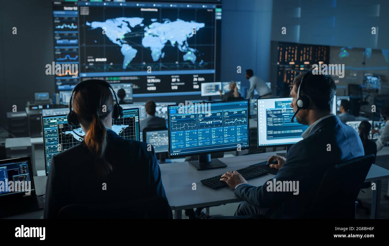 Shot of Officers in a Surveillance Control Center with Police Global ...