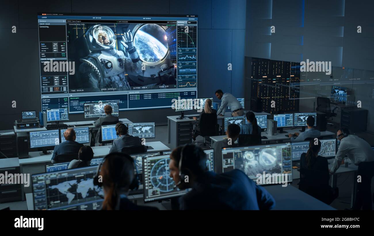 Group of People in Mission Control Center Establish Successful Video ...