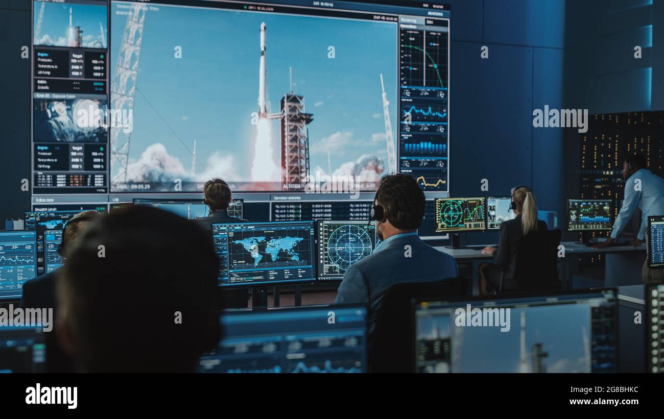 Group of People in Mission Control Center Witness Successful Space ...