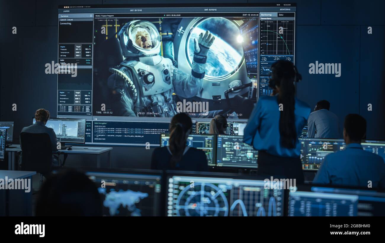 Group of People in Mission Control Center Establish Successful Video ...