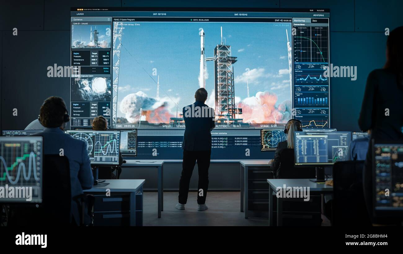 Group of People in Mission Control Center Establish Successful Video ...