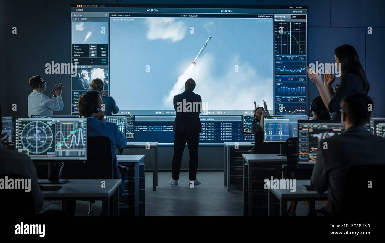 Group of People in Mission Control Center Witness Successful Space ...