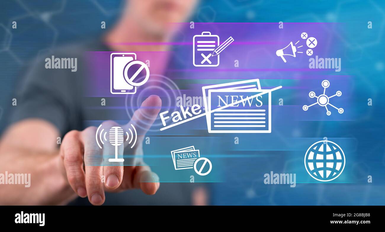 Man touching a fake news concept on a touch screen with his finger ...