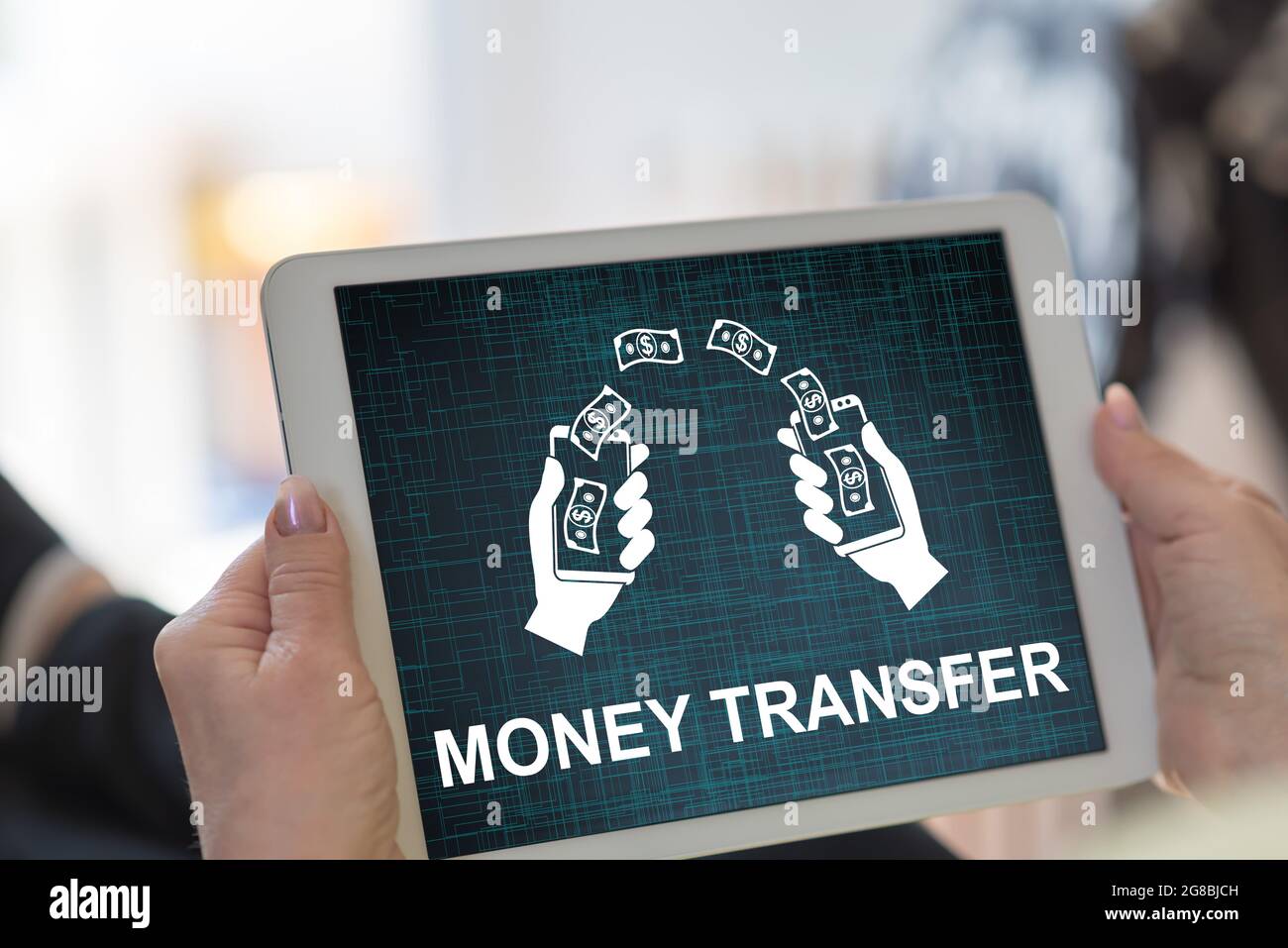 Tablet screen displaying a money transfer concept Stock Photo - Alamy
