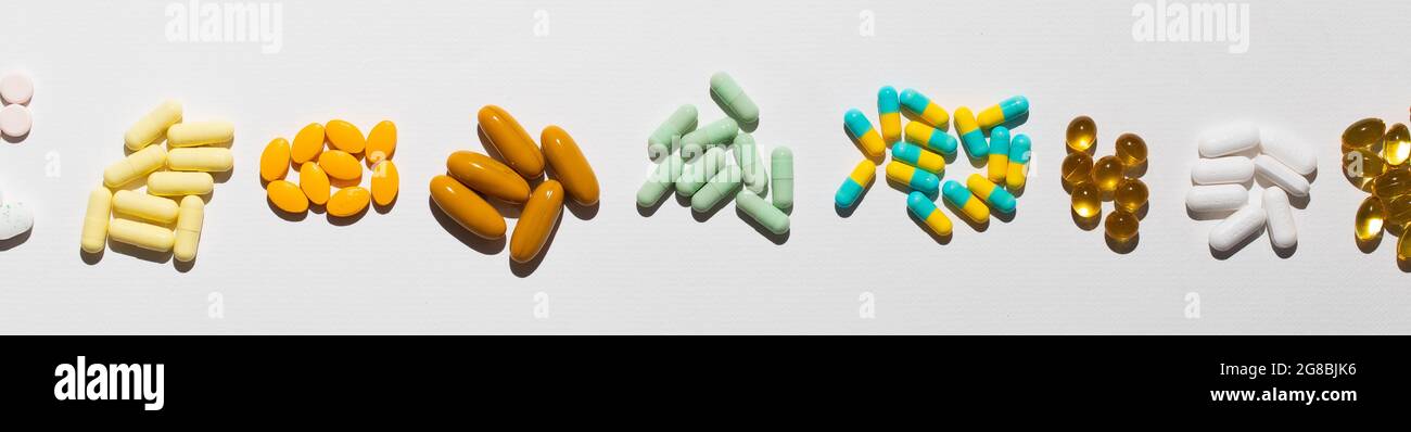 Group of assorted pharmaceutical medicine pills, colorful tablets and ...