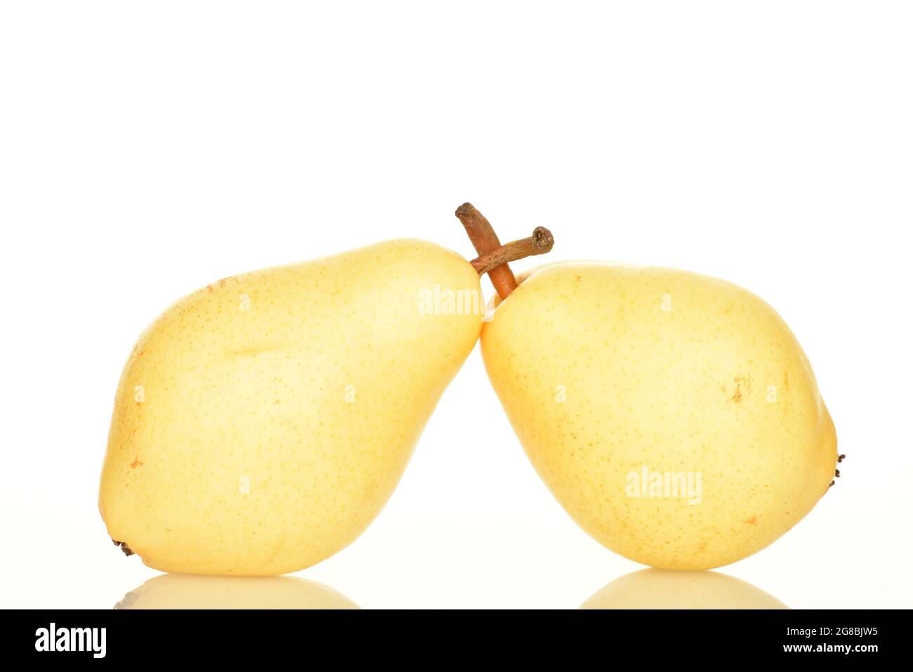 Two ripe organic yellow pears, close-up, isolated on white Stock Photo ...