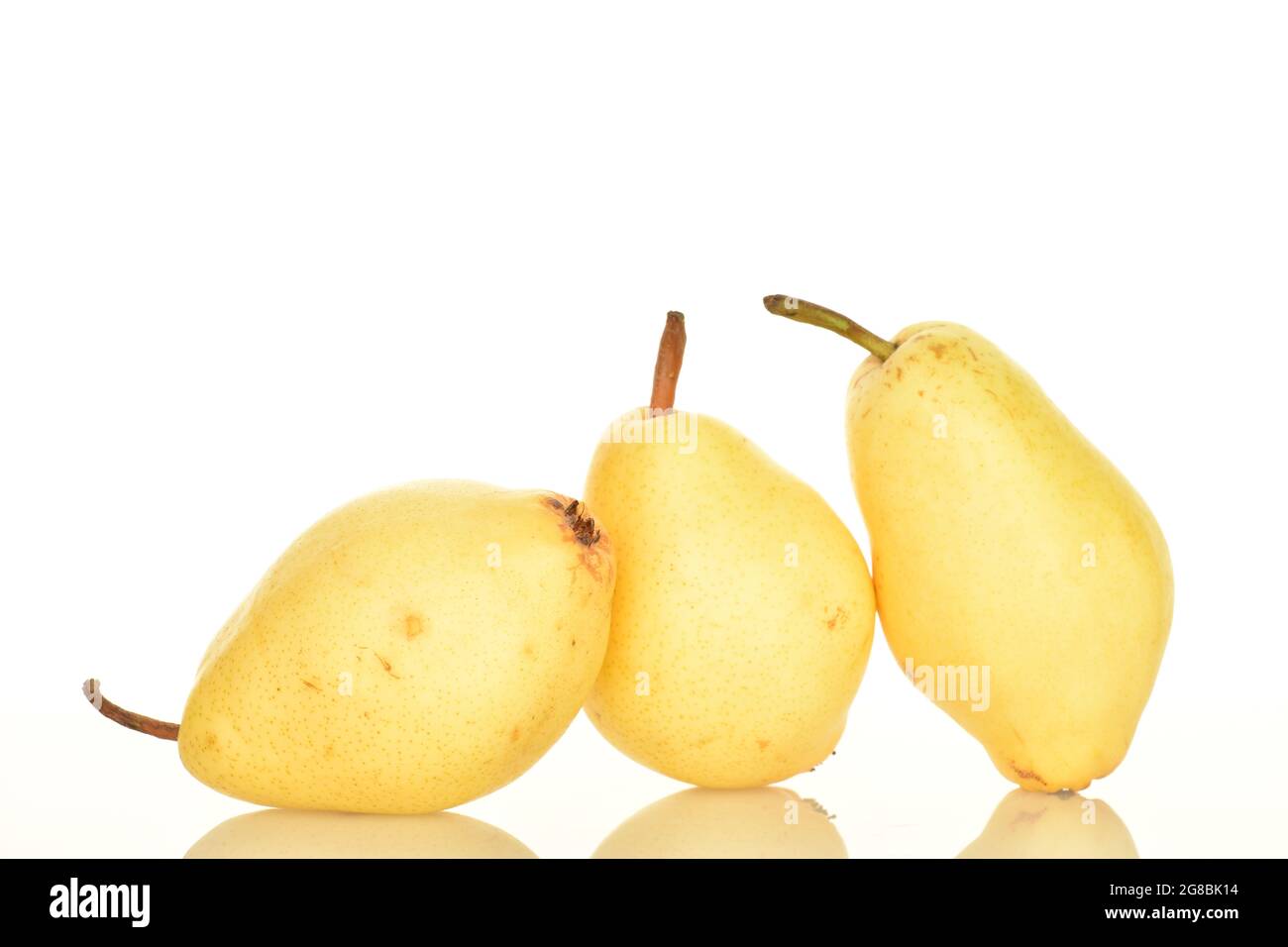 Three ripe organic yellow pears, close-up, isolated on white Stock ...