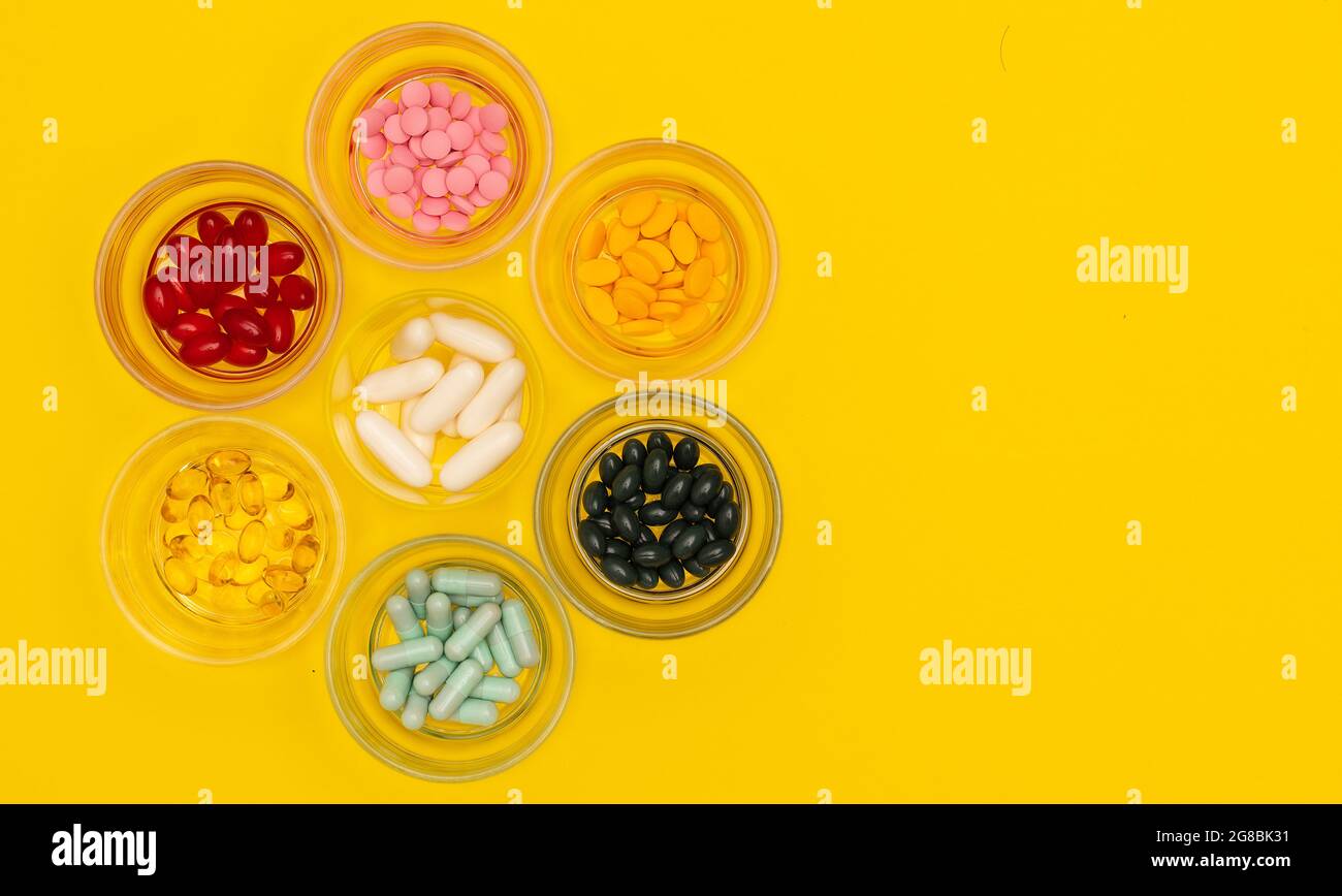 Assorted various kinds and many sizes of pills pharmaceutical in glass ...