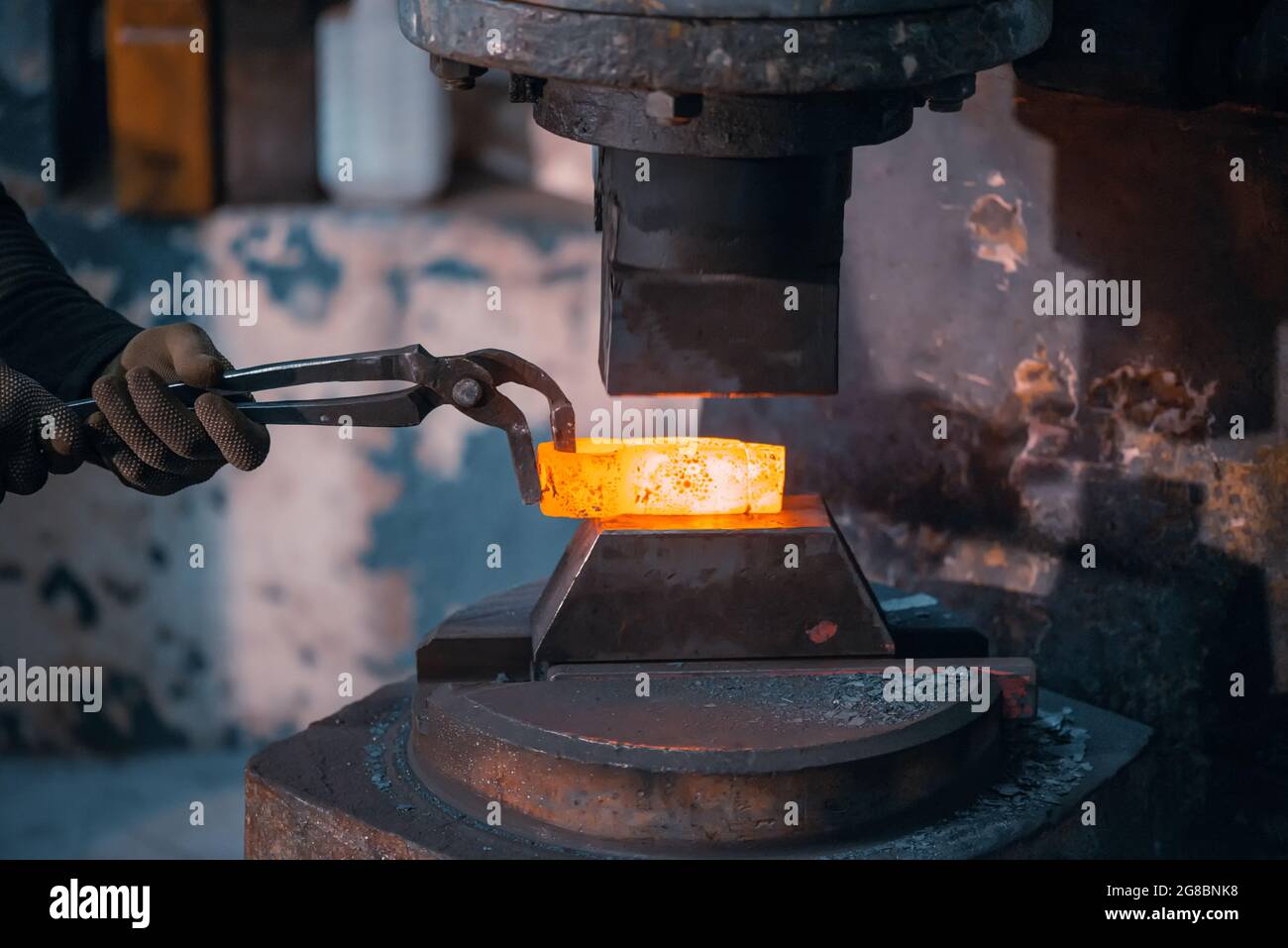 Blacksmith works on a blacksmith's hammer, a percussion machine Stock ...