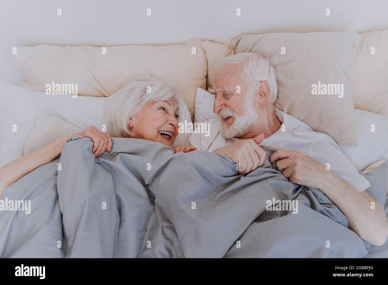 Beautiful senior couple enjoying time together at home - Romantic ...