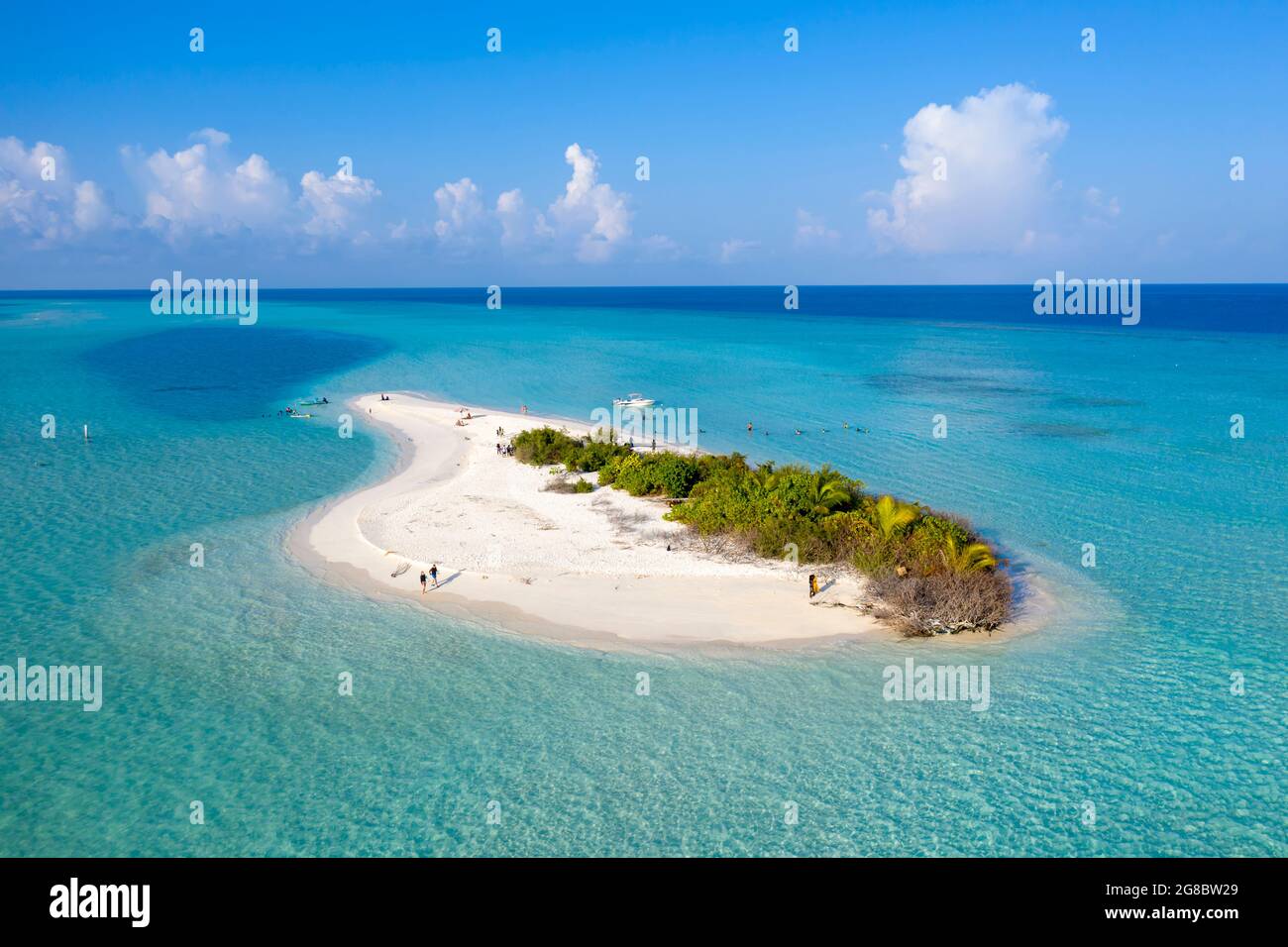 Aerial view of travelers on a small sandy island in the Indian Ocean ...