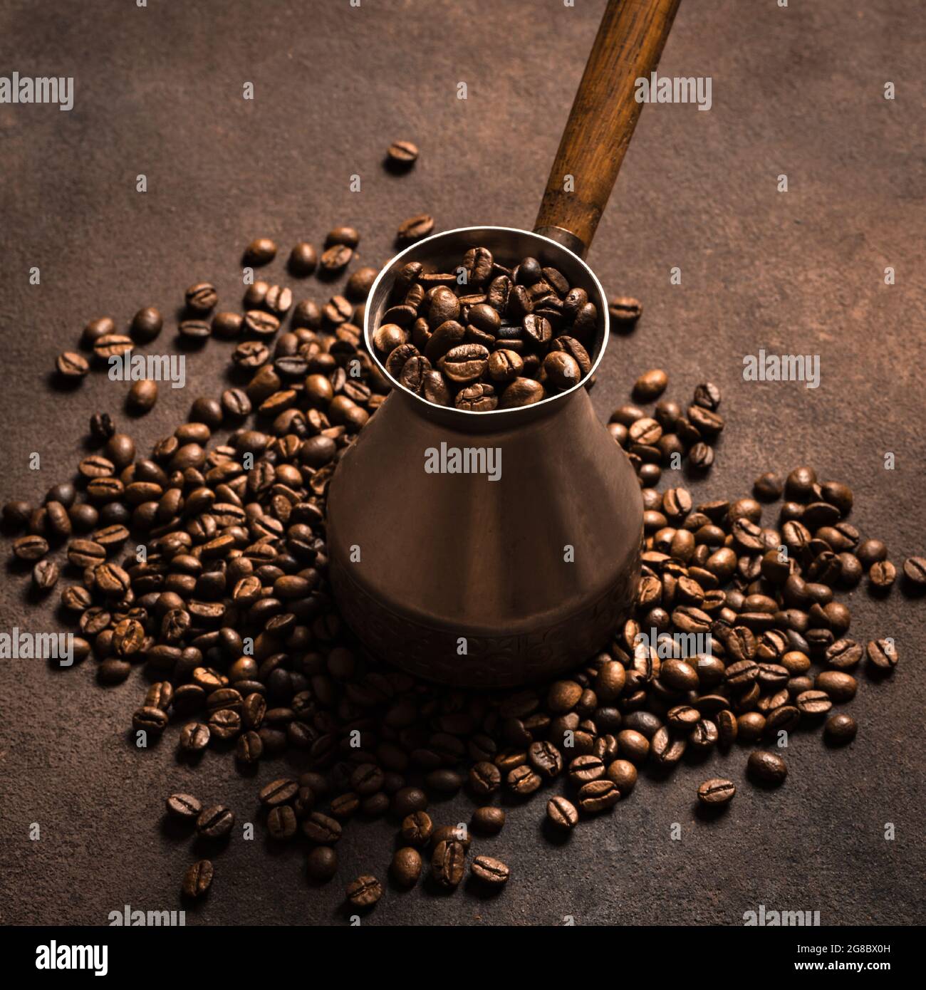 Roasted coffee beans and turk (cezve). Turkish coffee composition Stock ...