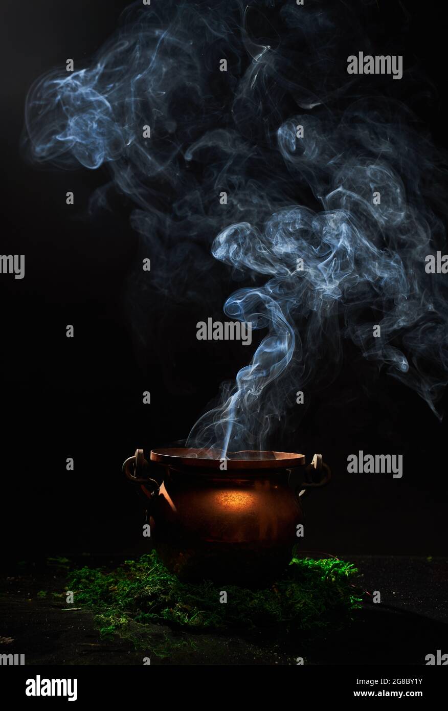 The witch's smoking cauldron on dark background. Scary Halloween ...