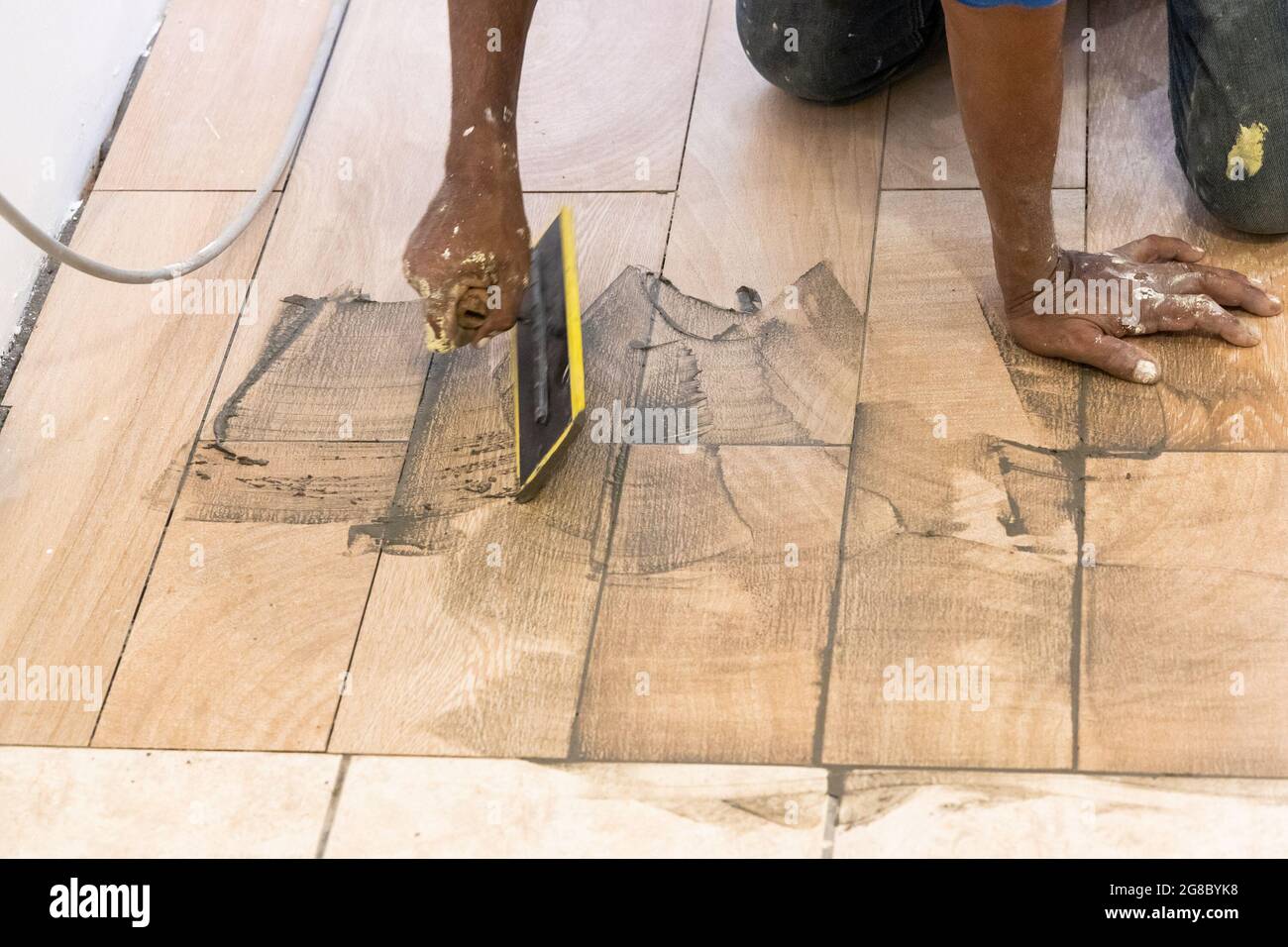 Applying tiles hi-res stock photography and images - Alamy