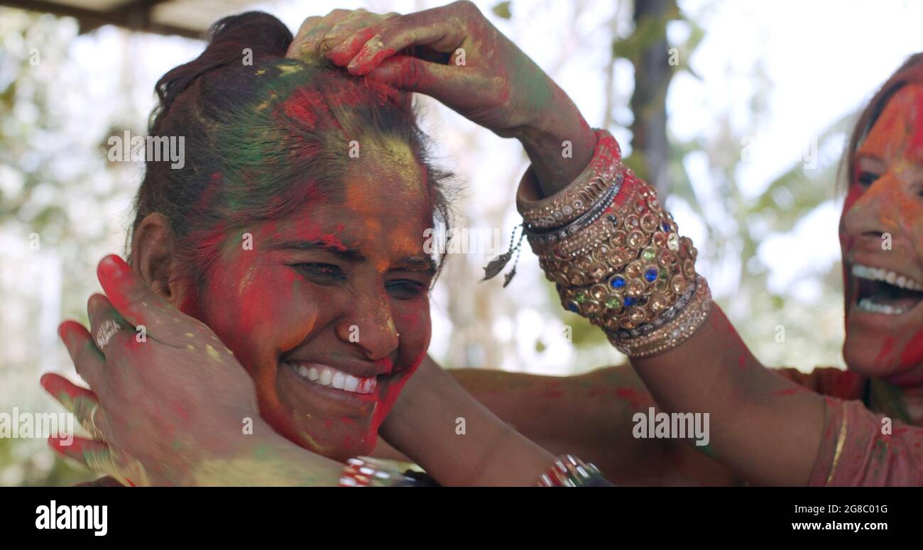 Happy females with painted faces during the Holi Hindu festival Stock ...